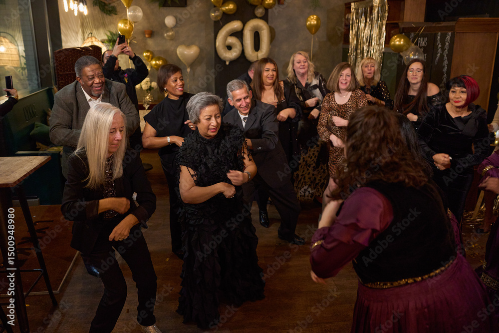 People attending dance show at 60th birthday party at nightclub Stock ...