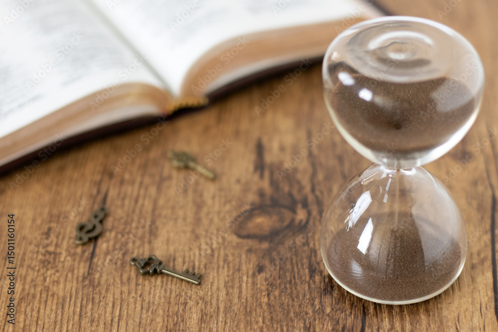 Stock-Foto „Hourglass, ancient keys and holy bible book it the ...