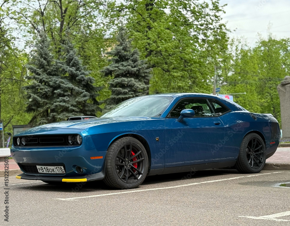Blue muscle car Dodge Challenger SRT Hellcat in a parking lot on street ...