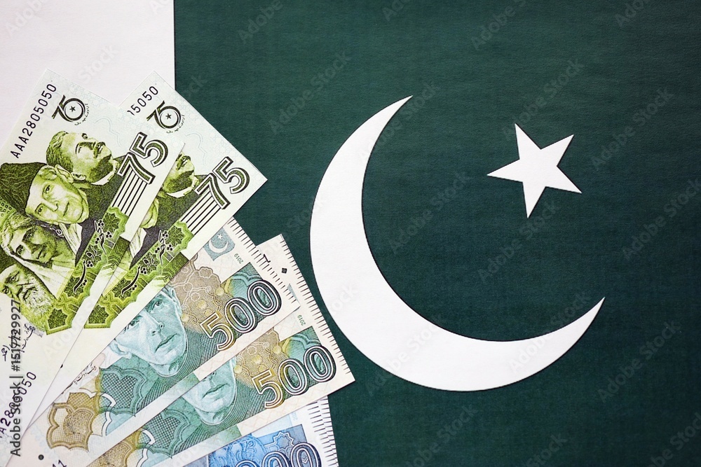 Pakistan rupees banknotes on Pakistani flag background. The current ...