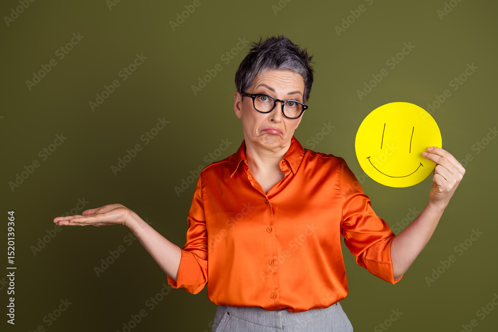 Stock-Foto „Mature professional woman in colorful attire holding a ...