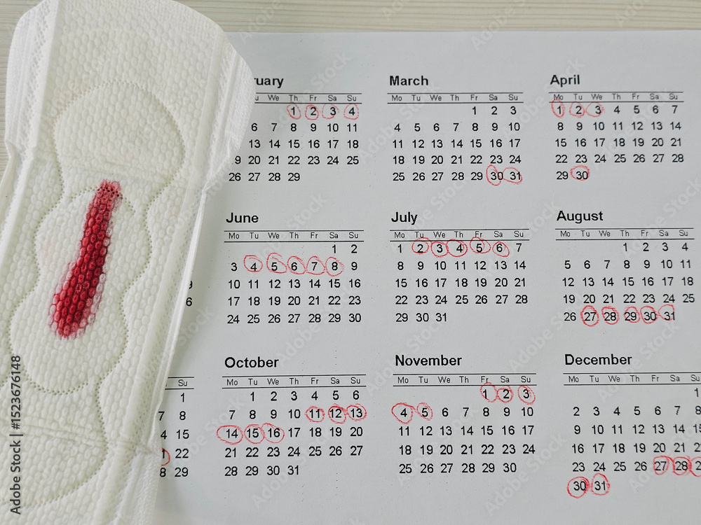 Calendar tracking monthly periods with sanitary product Stock Photo ...