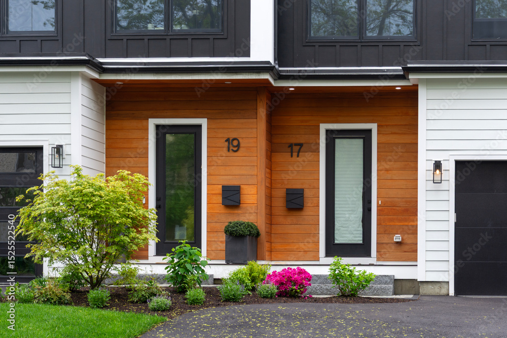 Front entry of a modern duplex house on a spring day in Newton ...