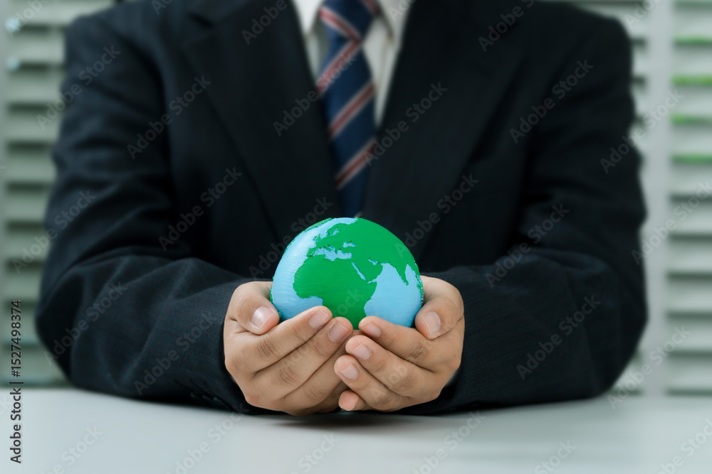 Businesshand holding green earth with renewable energy. Carbon emission ...