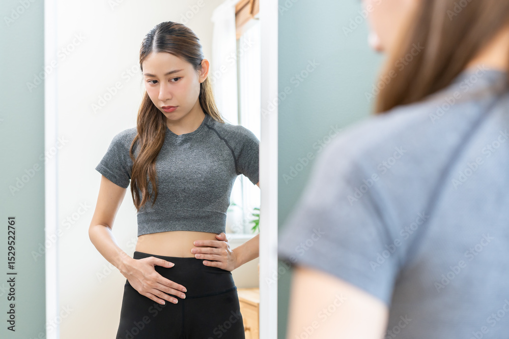 Excess weight gain, overweight asian young woman touching stomach ...