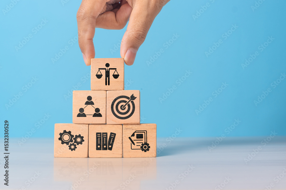 Hand holding wooden block with Ethical icons, business ethics and ...