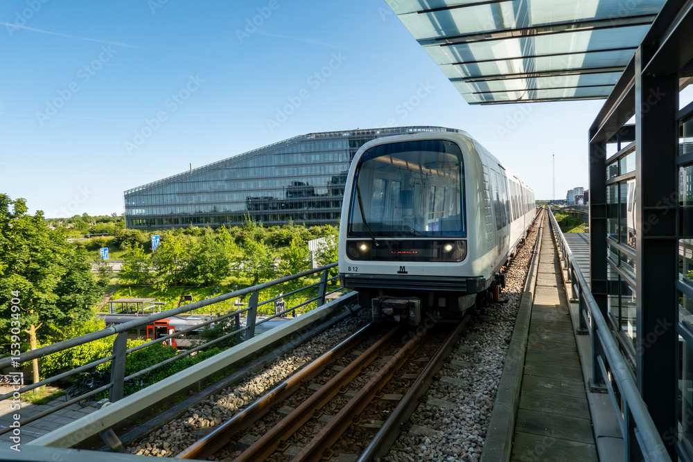 Copenhagen, Denmark An elevated Metro train on the M1 line passes the ...