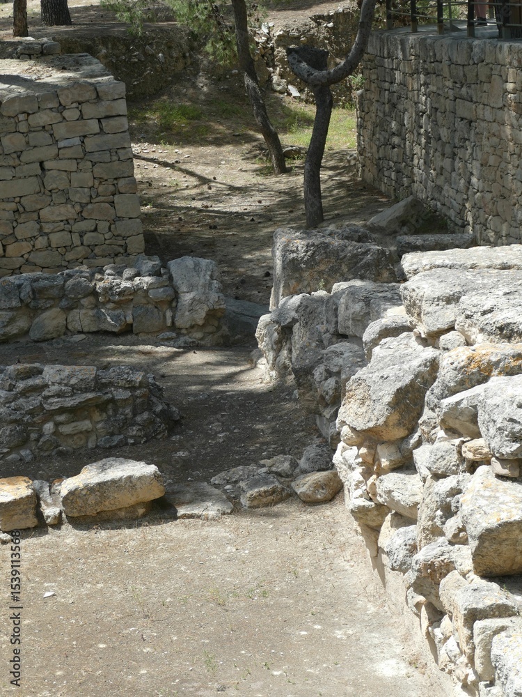 Stone foundations, low walls revealing archaeological remnants of ...