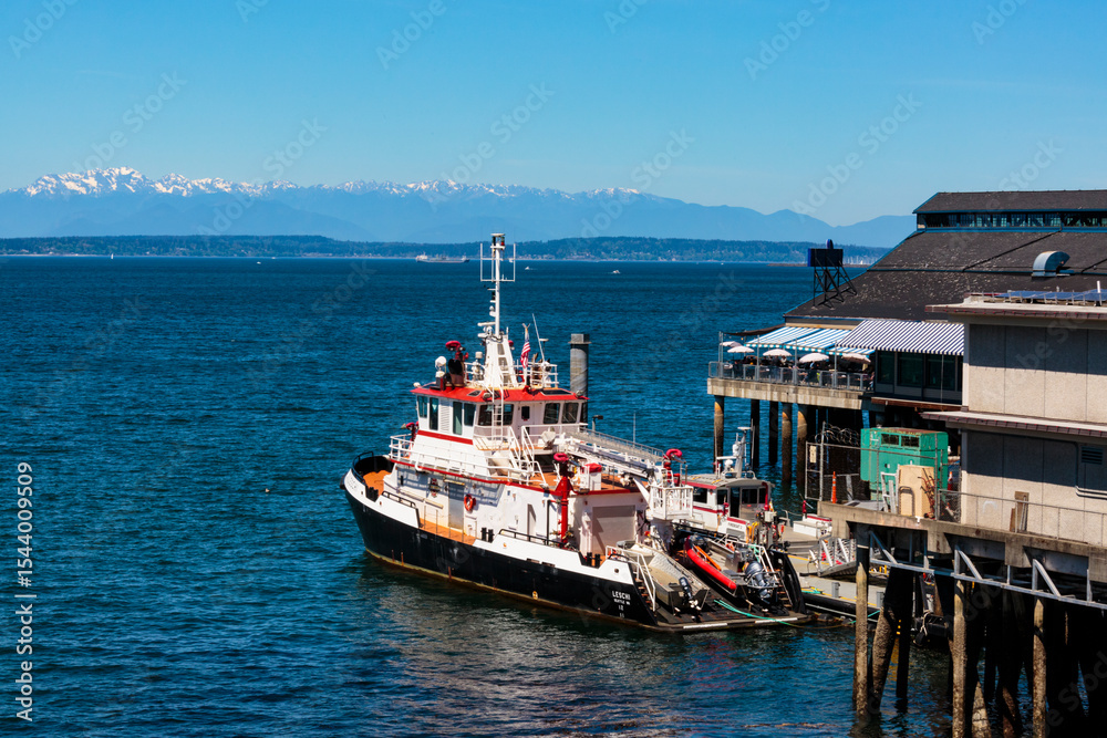 Seattle Waterfront with the Great Wheel, Ivar's and the Leschi fire ...