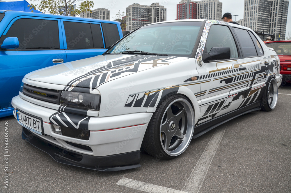 White Volkswagen Vento (Golf Mk3) sedan with striking black, gold, and ...