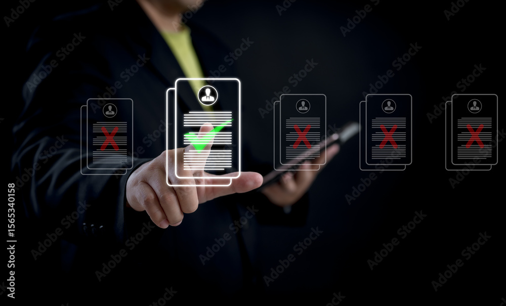 Businessman using digital interface to select candidate profile with ...