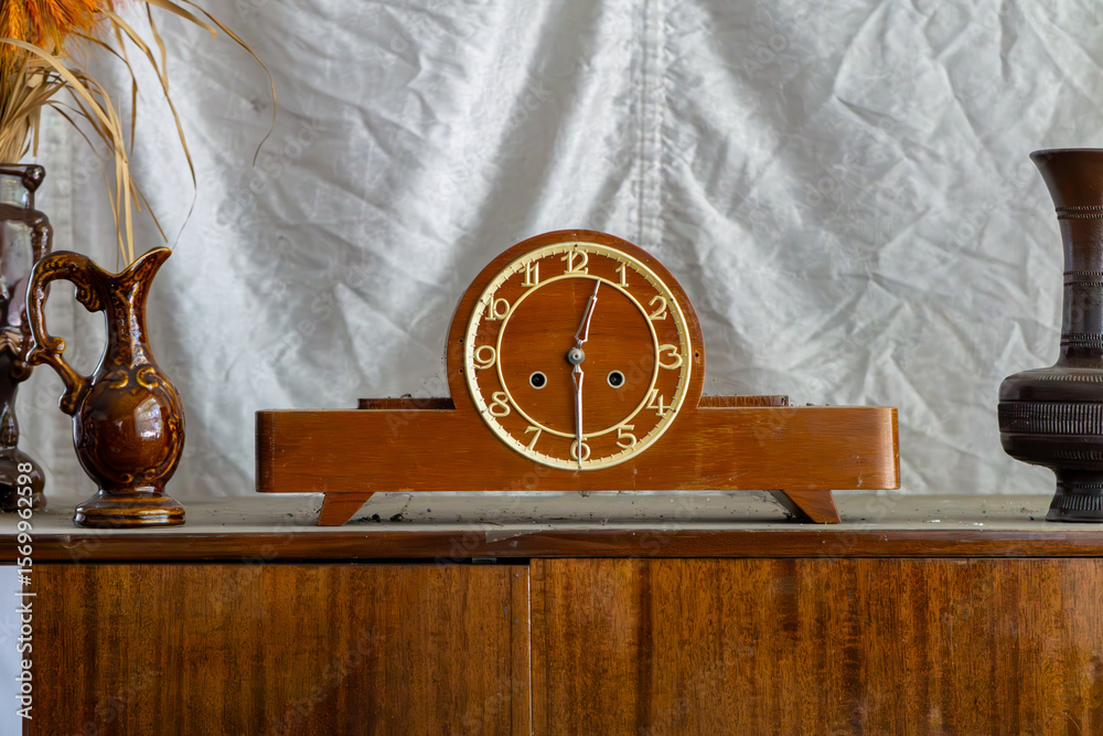 Vintage wooden mantel clock from the communist era, placed on a ...