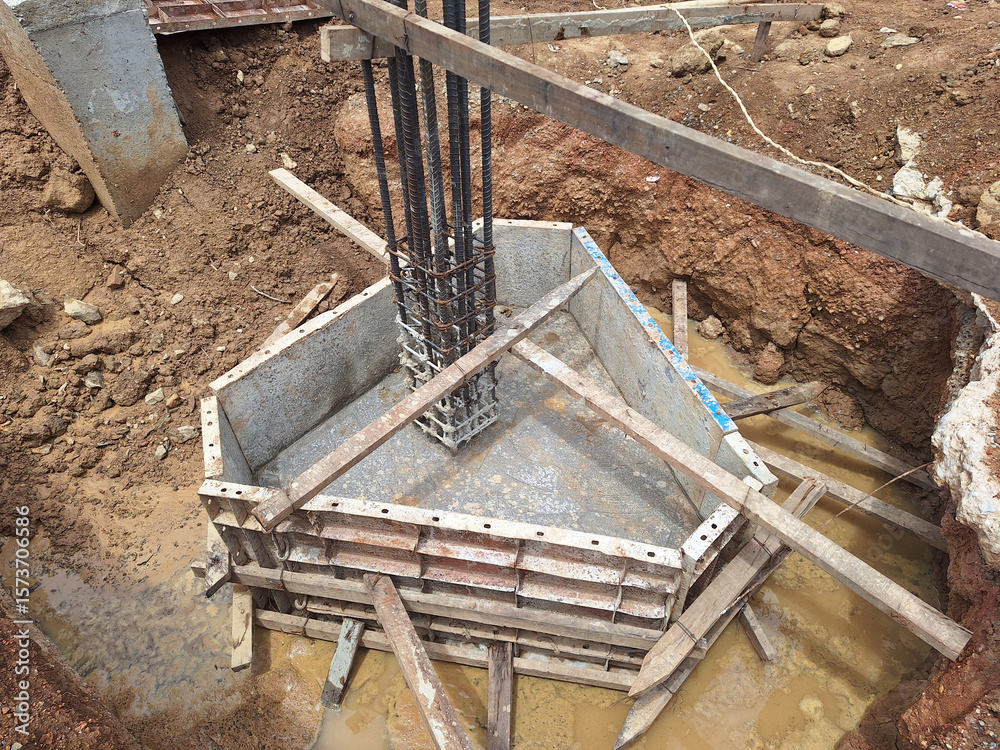 Triangular foundation formwork ready for pouring concrete with pile ...