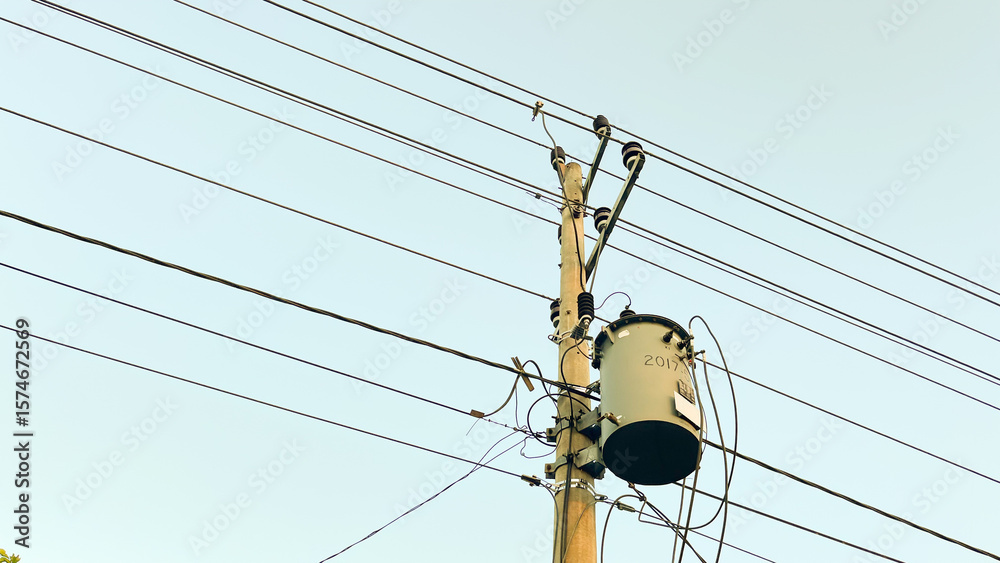 electric pole with a transformer or power stabilizer in the middle ...