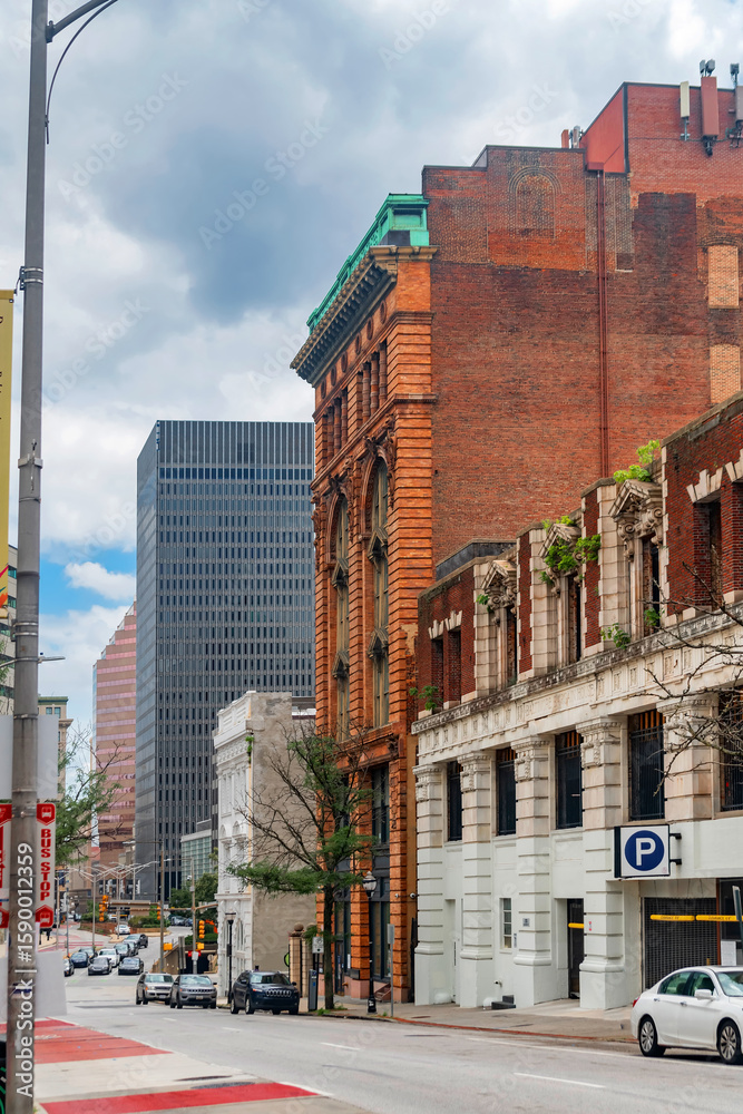 Baltimore street scene with high-rise buildings. Modern towers, red ...