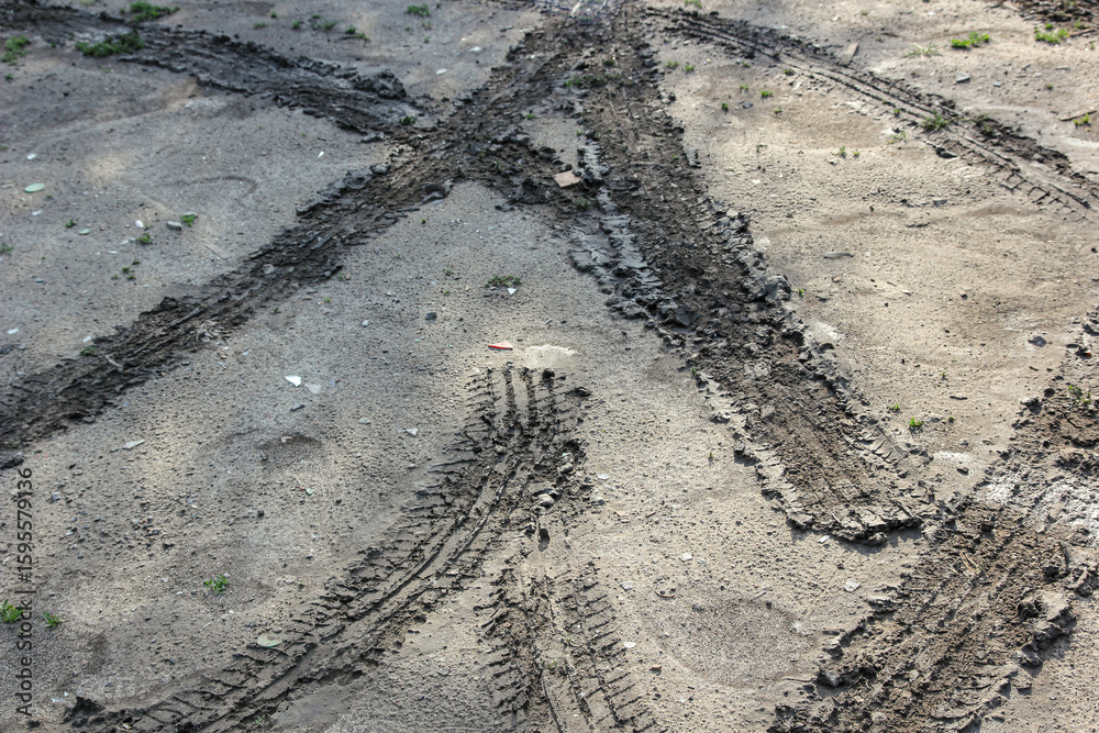 Tire tracks on muddy ground after rain. Vehicle tread marks clearly ...