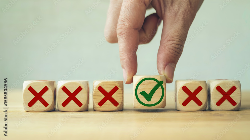 Hand selects checkmark block amidst x marks, indicating choice and ...