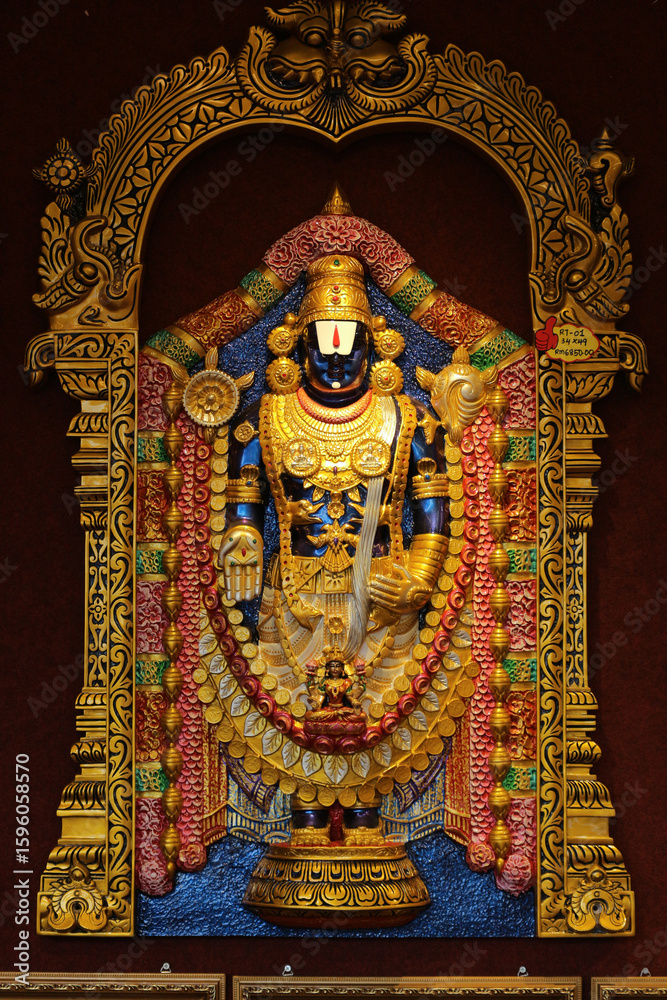 Golden statue of Lord Balaji (Venkateswara), Hindu deity in traditional ...