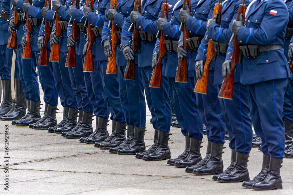 Line of Polish police officers in ceremonial uniforms holding rifles ...