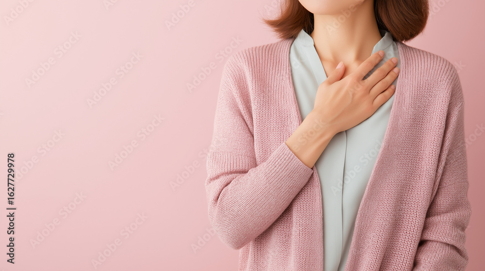 Japanese woman holding hand over chest, symbolizing mental health and ...