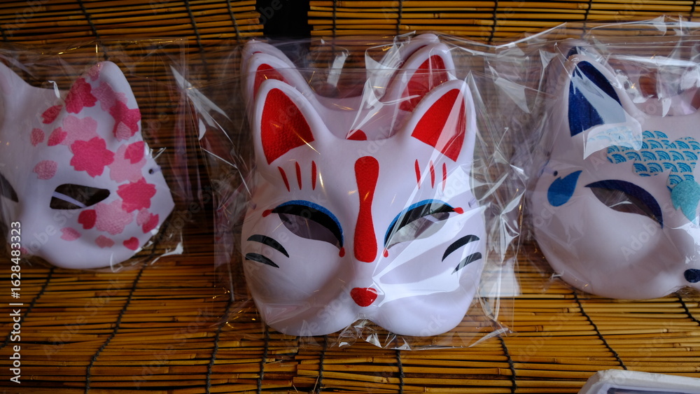 Traditional kitsune mask (fox mask) sold at a souvenir store in front ...
