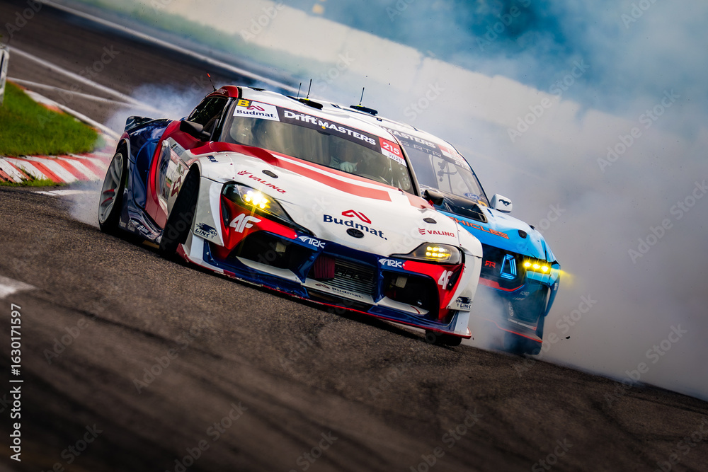 Latvia, Riga, 2025-07-26, Drift Master Two race cars are racing on a ...