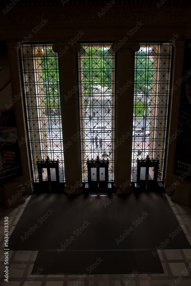 Grand Entryway with Ornate Windows and Columns Framing View of Tree ...