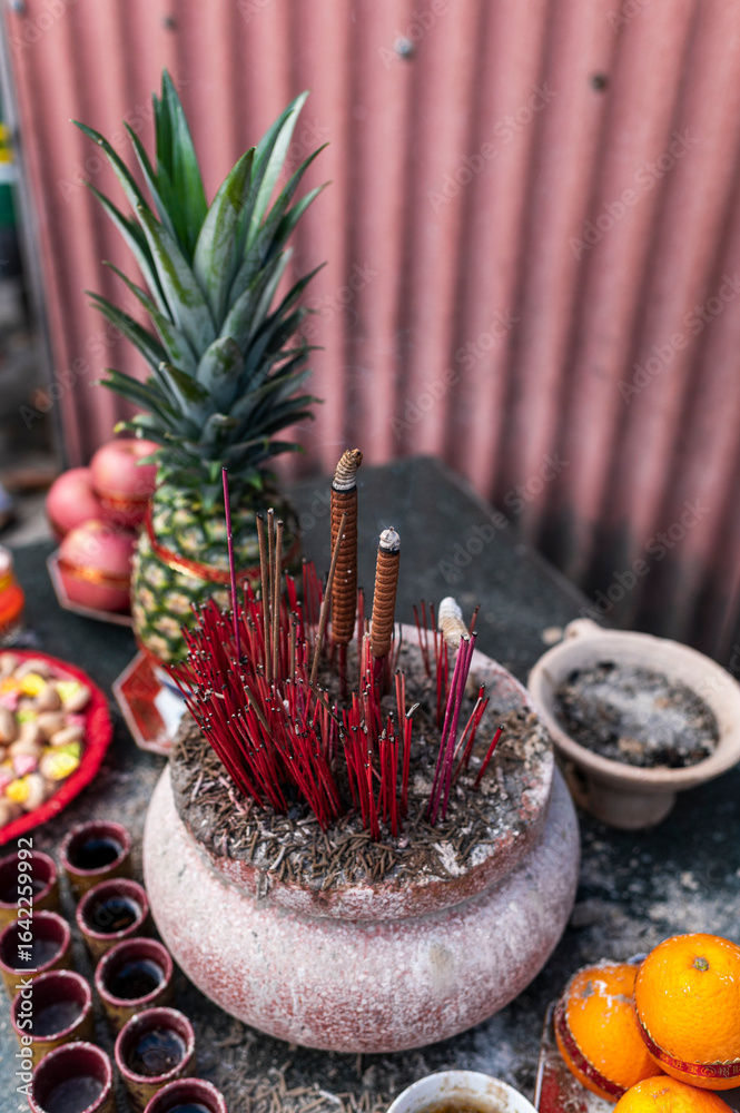 Incense red sticks and fruit altar Stock Photo | Adobe Stock
