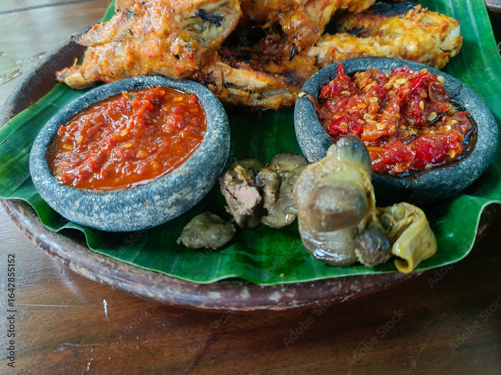 Side dishes at a restaurant with fried chicken, fried chicken liver ...