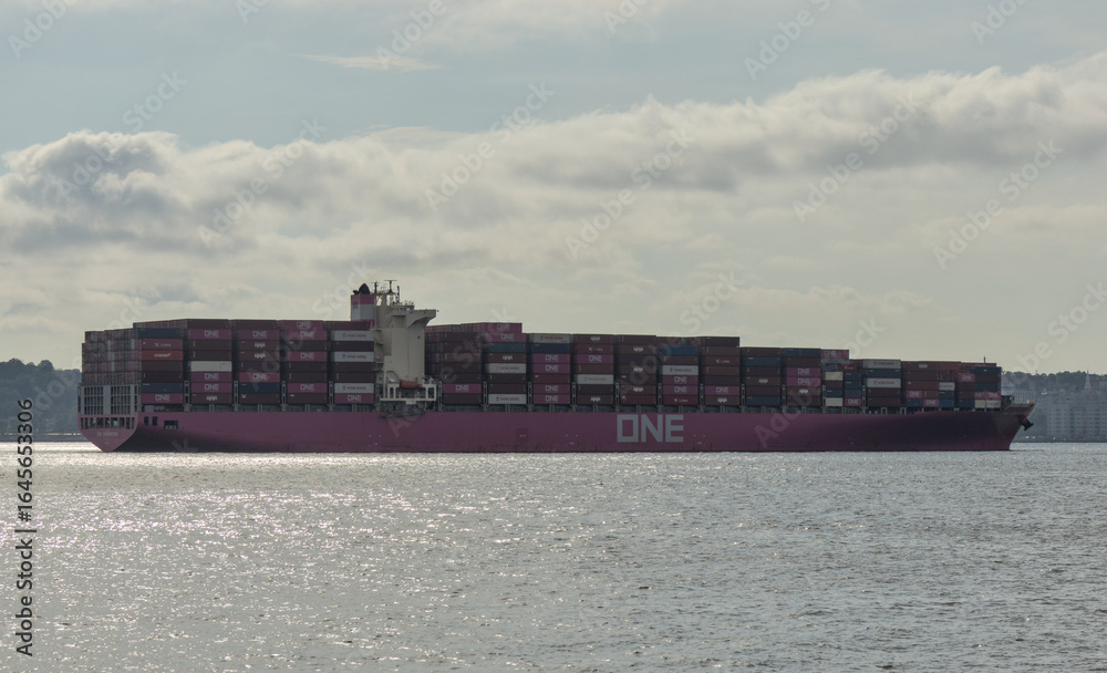 large shipping container ship arriving in new york city harbor under ...
