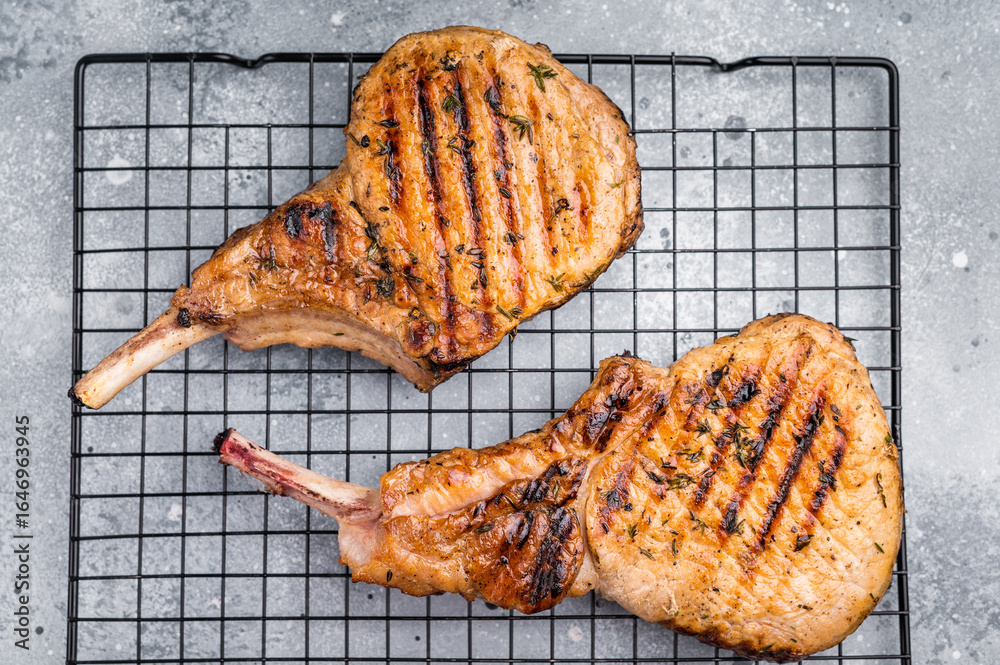 Juicy grilled pork Tomahawk chop, perfectly seared and bursting with ...