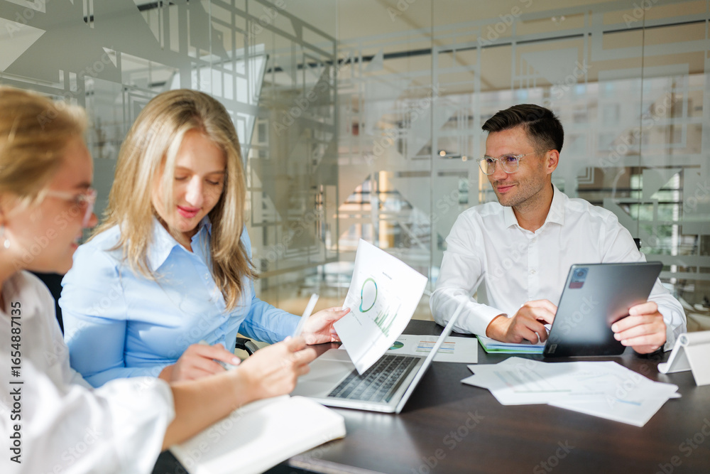 Collaborative teamwork in a modern office environment focusing on ...