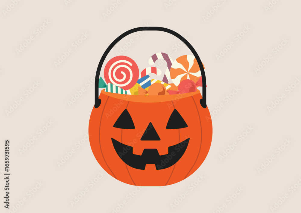 Orange pumpkin bucket filled with assorted candies and lollipops, jack ...