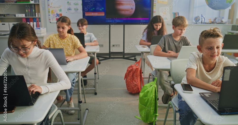Primary School Students Working on Creative Projects on Laptops ...