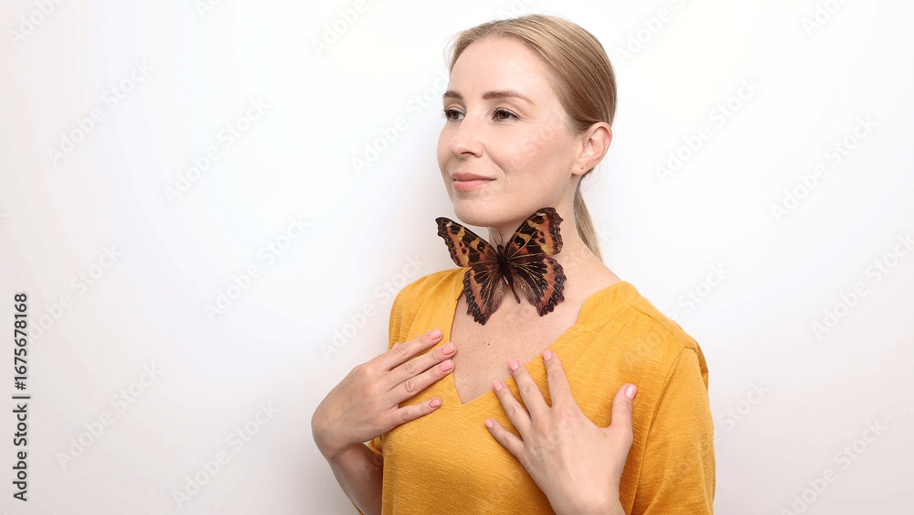 Woman with a butterfly on her neck, symbolizing an enlarged thyroid ...
