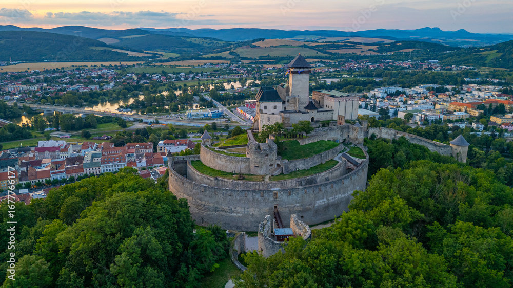Sunset with Trencin castle overlooking the old town, Slovakia Stock ...