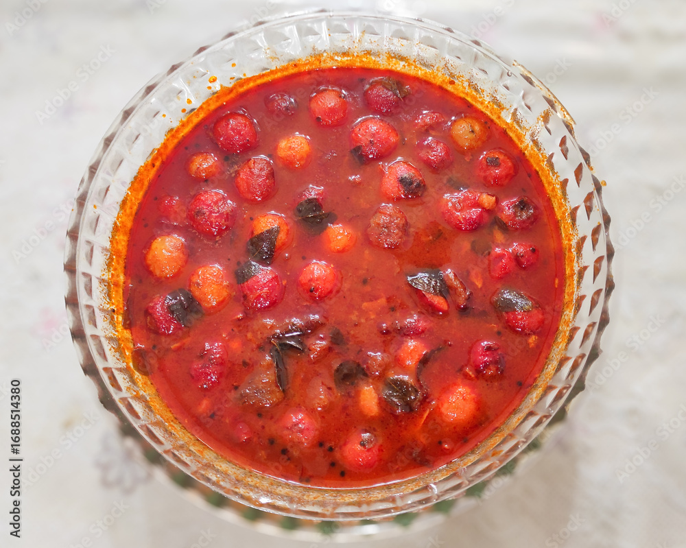 Stock-Foto „Indian coffee plum pickle made with Flacourtia jangomas ...