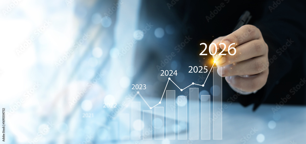 Businessman analyzing financial growth chart for 2026 year.Showing ...
