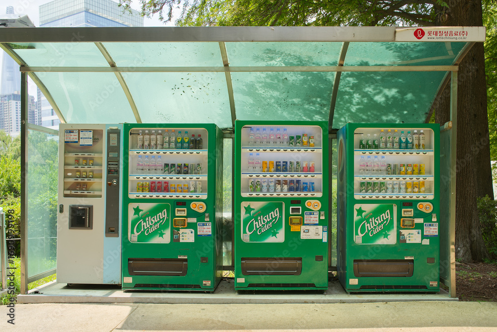 Green vending machines outside dispensing cold canned and bottled ...