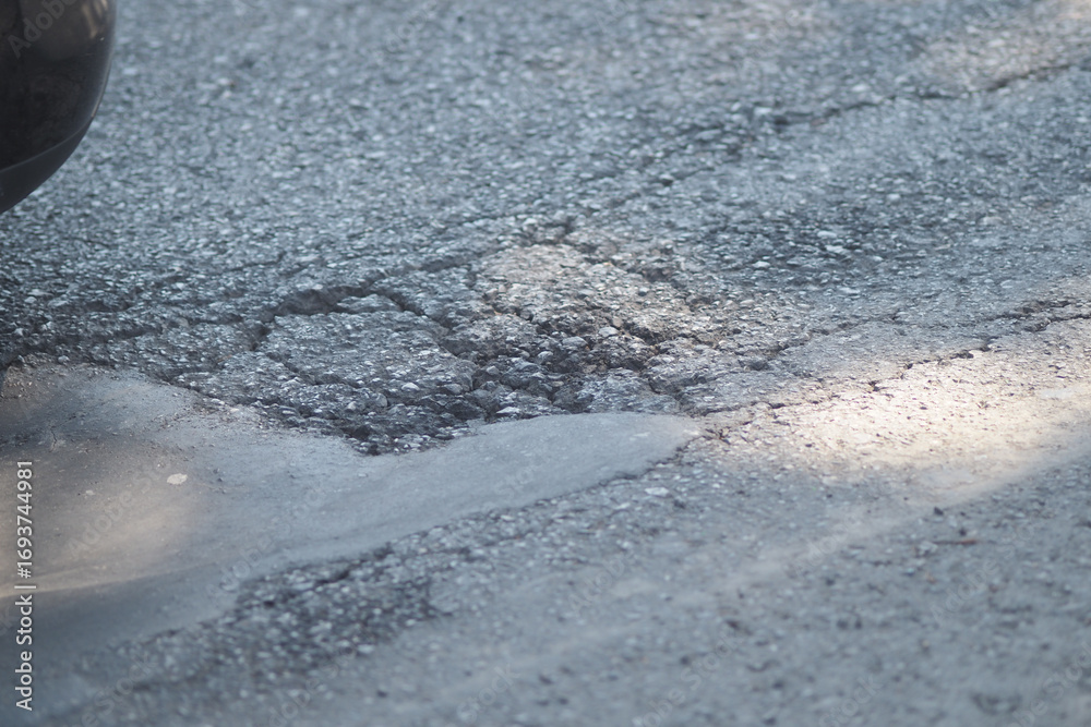 Pothole on a city street seen during daylight hours Stock Photo | Adobe ...