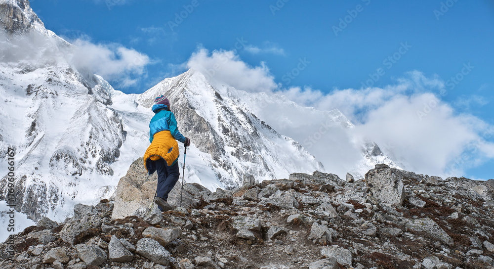 Beautiful panoramic view of walking hiker with mountains in background ...