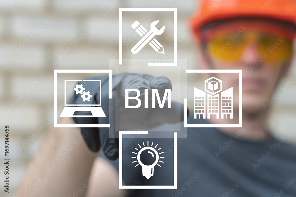 Engineer in hard hat using virtual touch screen presses the acronym BIM ...