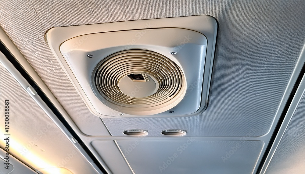 smoke detector on the ceiling of a commercial airplane cabin for fire ...