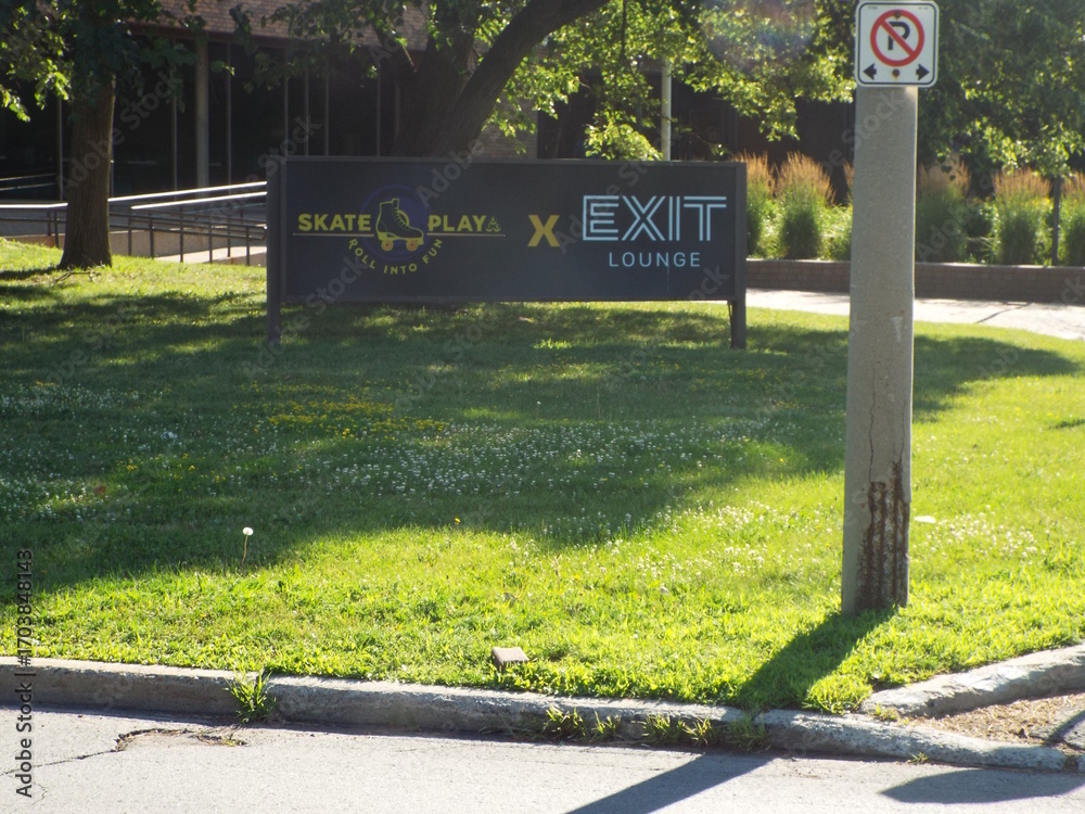 Ottawa, ON, Canada, June 18, 2025:A sign for two businesses: "Skate ...