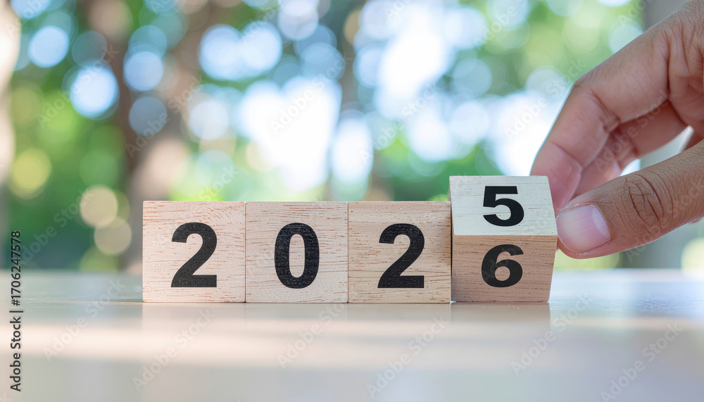 Wooden cube blocks showing 2025 changing to 2026 - New Year Stock Photo ...