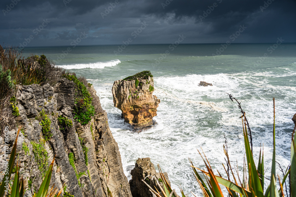 Sharp Limestone Cliffs with Isolated Sea Stack at Pancake Rocks ...