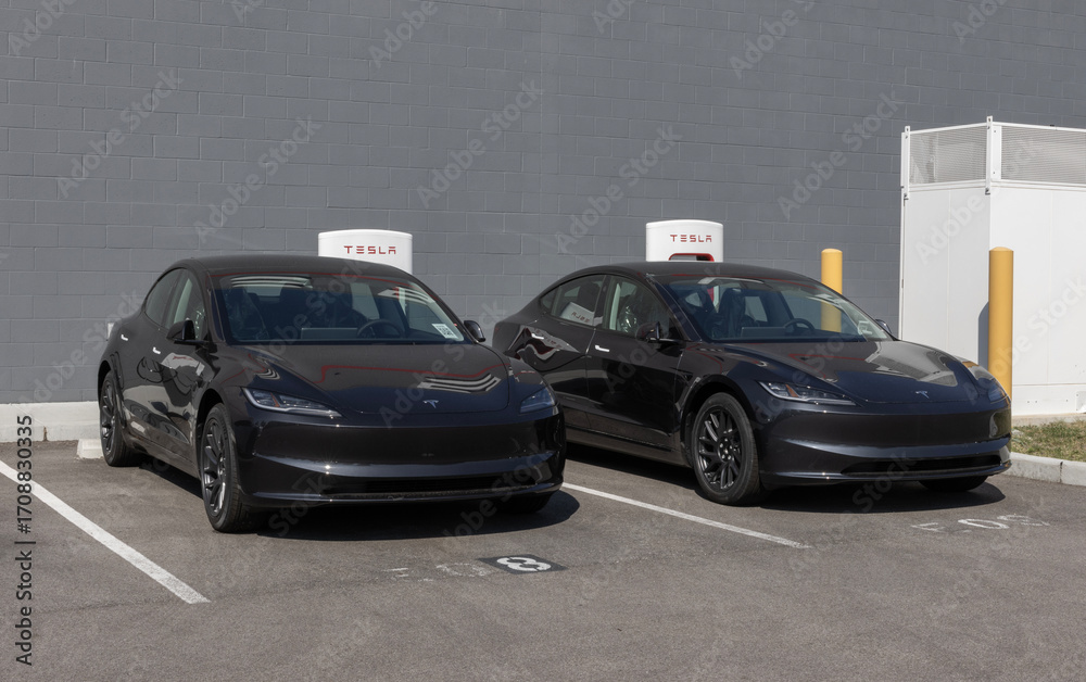 Tesla Model 3 display at a dealership. Tesla offers the Model 3 with ...