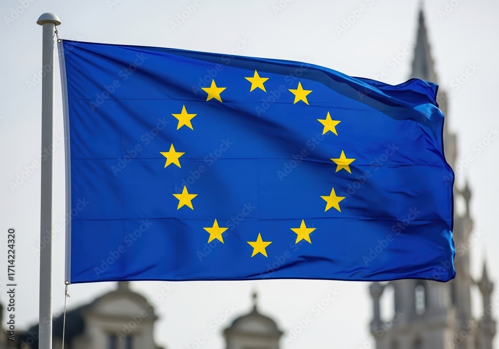 Waving European Union flag with a circle of golden stars in a historic ...