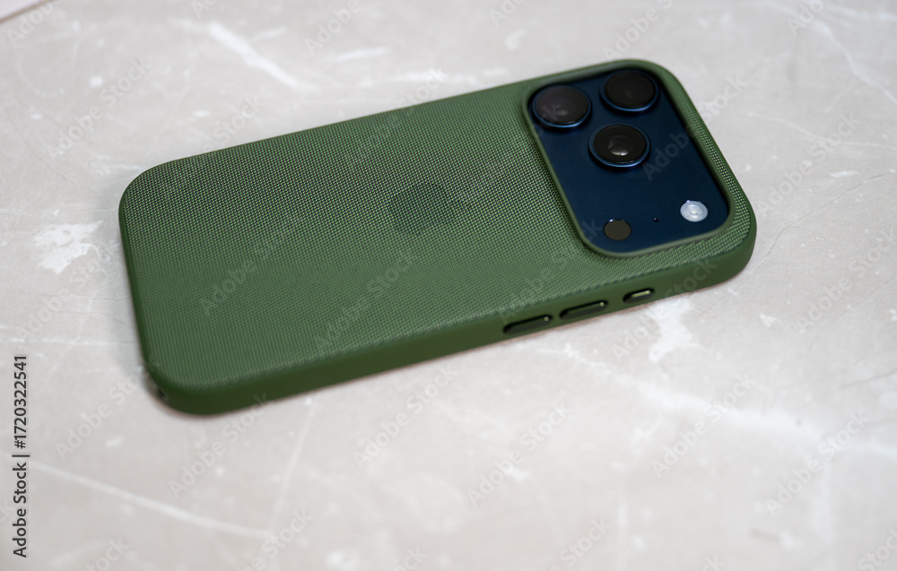 SEATTLE, USA - September 22, 2025: Close up of New iPhone 17 Pro in Deep Blue Color Inside Green ...