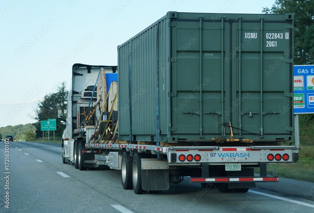 Virginia, U.S.A - Sep 9, 2025 - A loaded flatbed trailer with a ...